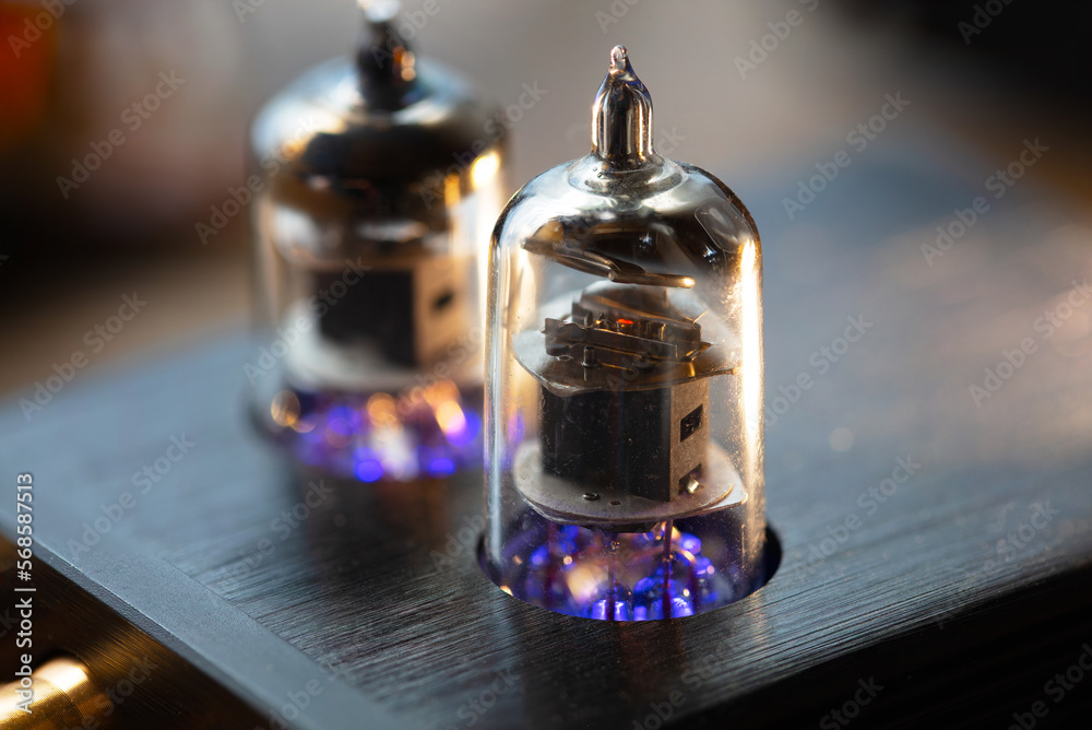 The tube sound, the valve sound. A vacuum tube in a socket of an audio ...