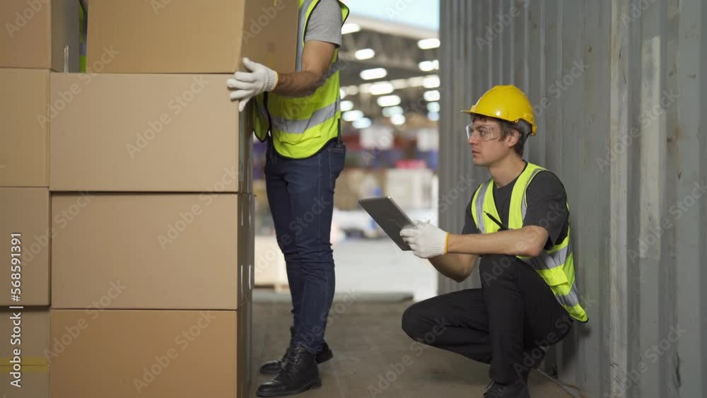 Teamwork of workers working in large warehouse retail store industry ...