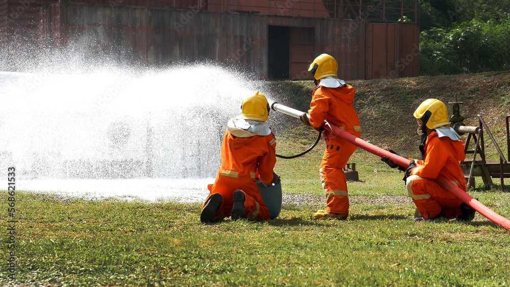 Firefighter Rescue team training in fire fighting extinguisher ...
