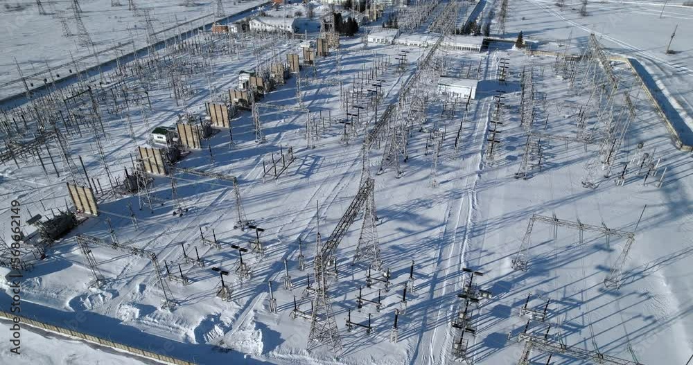 Transformer substation. Electrical substation in winter aerial shot. An ...