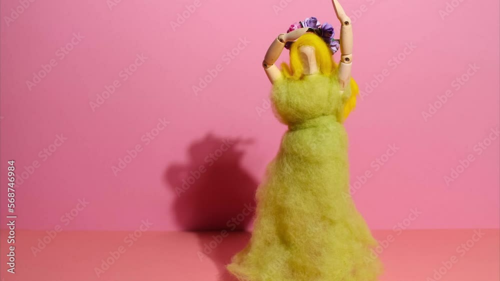 Stop motion animation, moving wooden doll made of felt. Female doll ...