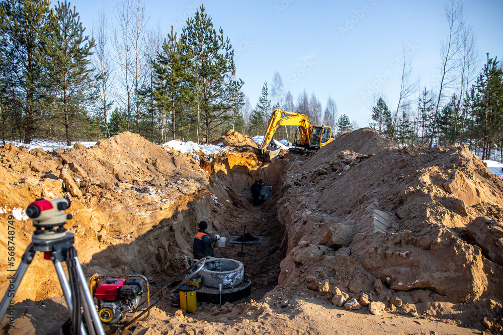 Bulldozer bucket close-up digs a pit for the construction. The ...