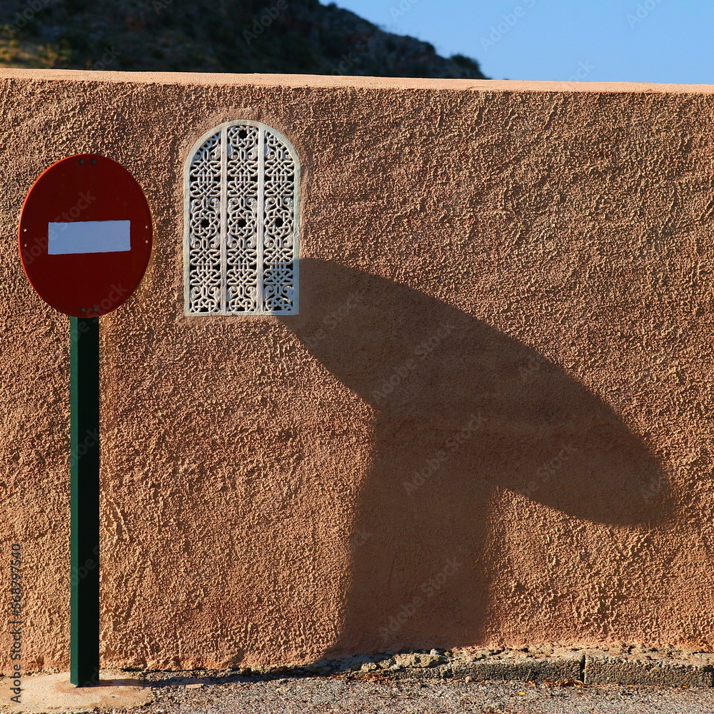 No entry sign with ochre Spanish wall behind it with shadow Stock Photo ...