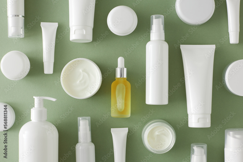 Skin care products concept. Flat lay photo of cosmetic bottles without ...