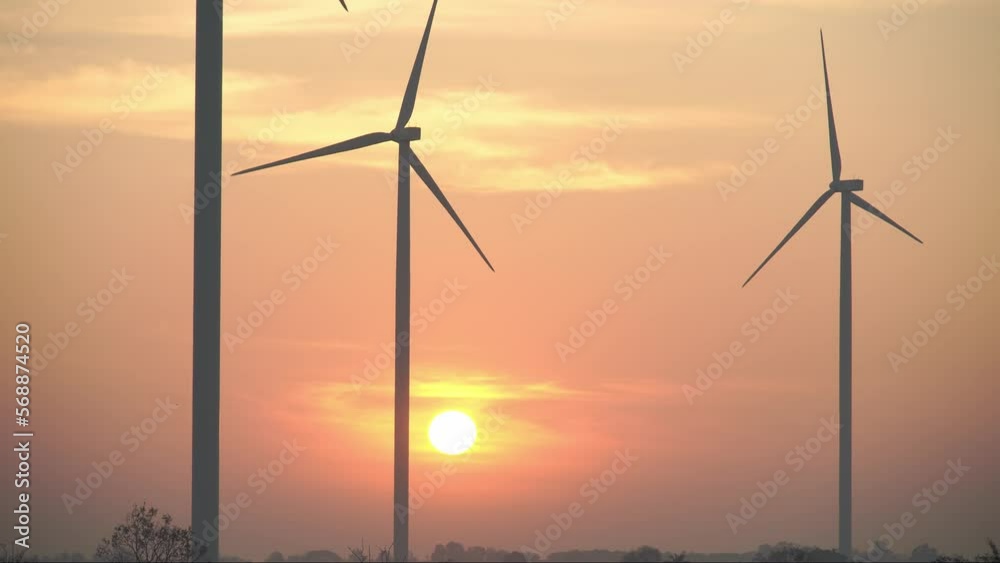 wind turbine in morning tropical forest at morning with constant air ...