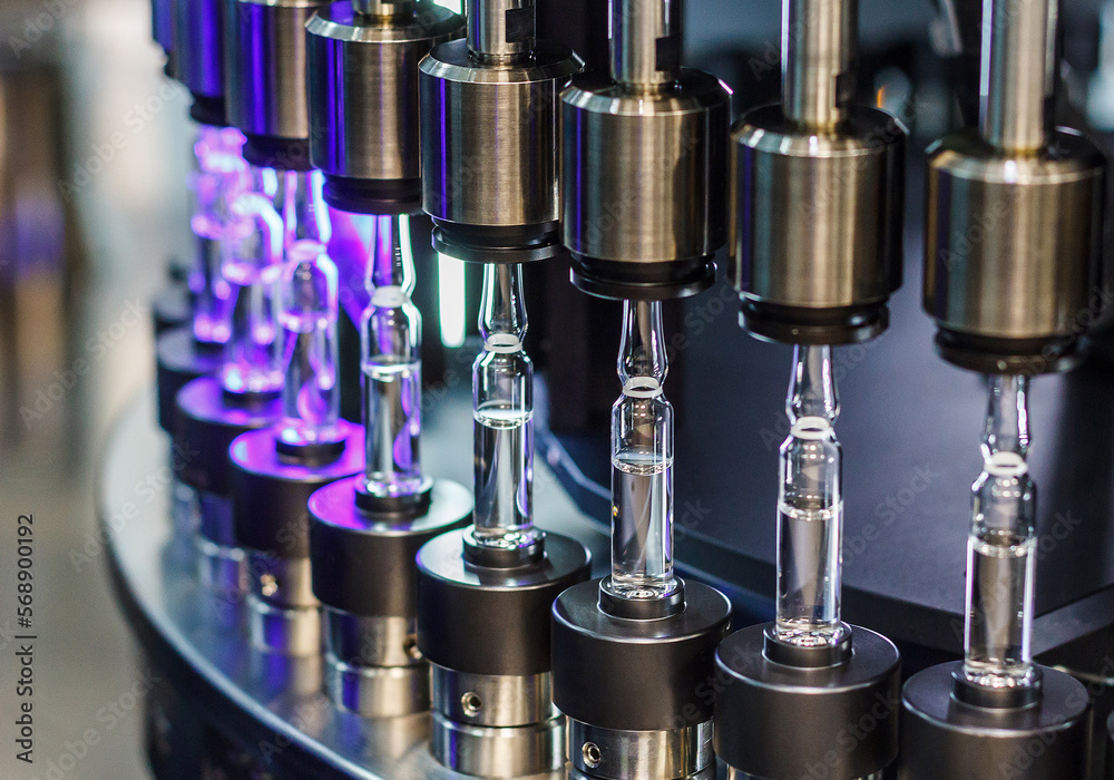 Medicine in ampoules. Group of vaccine bottles. Glass vials for liquid ...