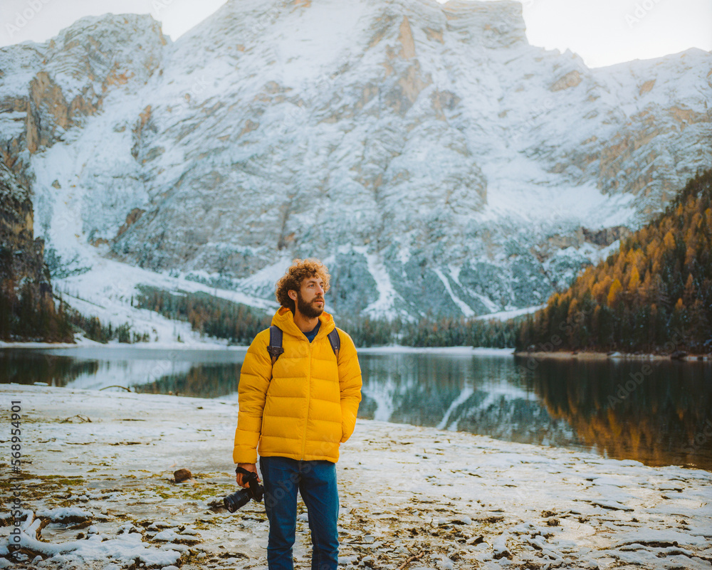 Man near Lago di Braies in winter Stock Photo | Adobe Stock