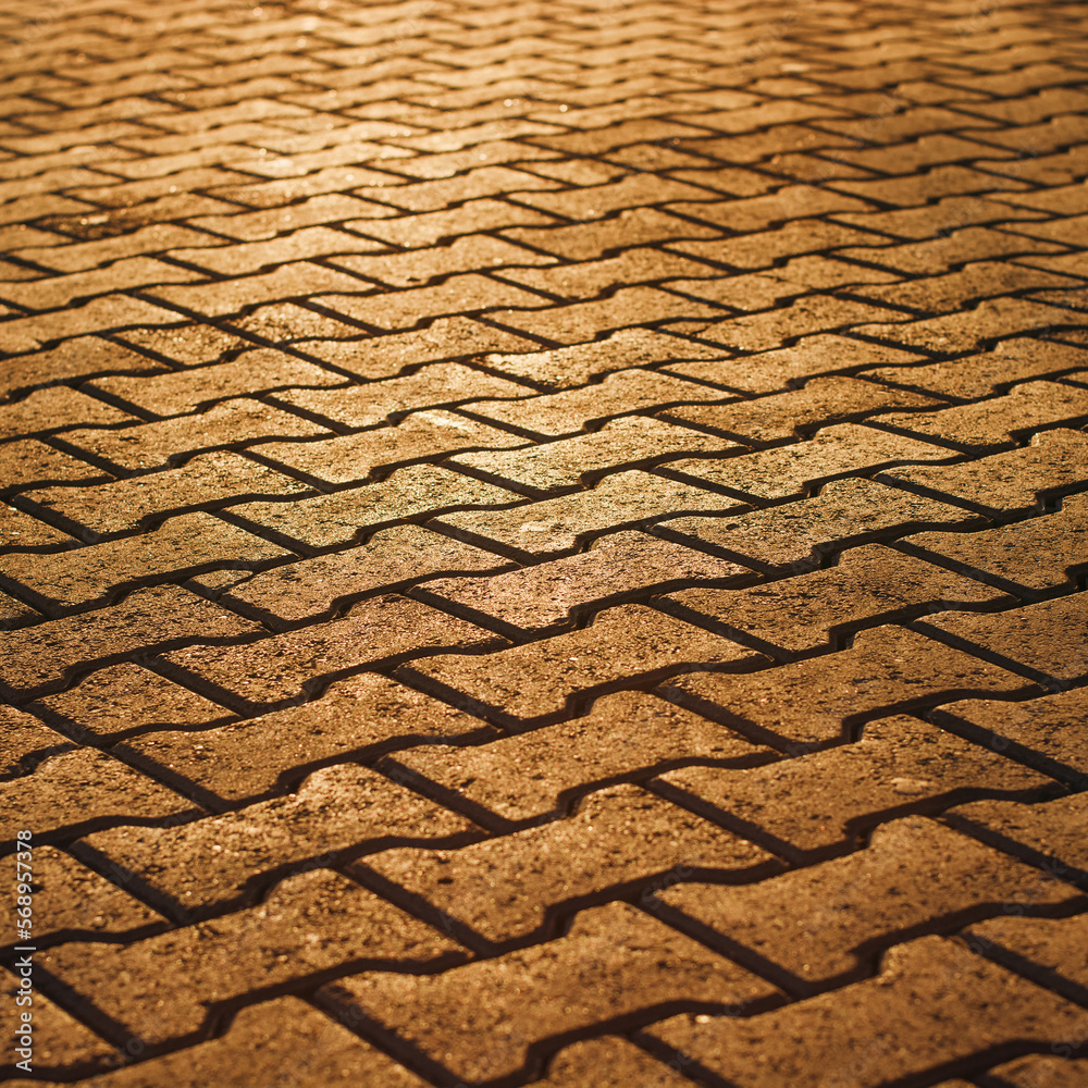 Perspective of paving slabs in golden light. Minimal background with ...