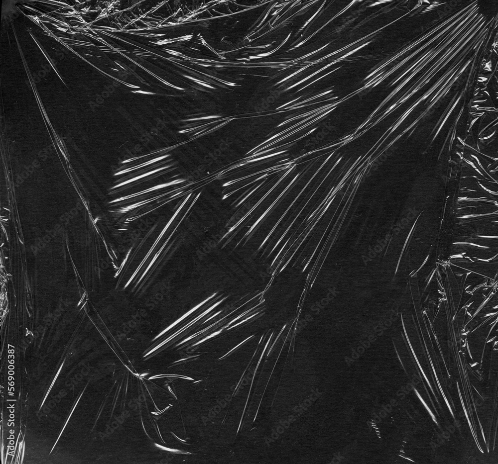 Wrinkled plastic wrap texture on a black background wallpaper. Royalty ...