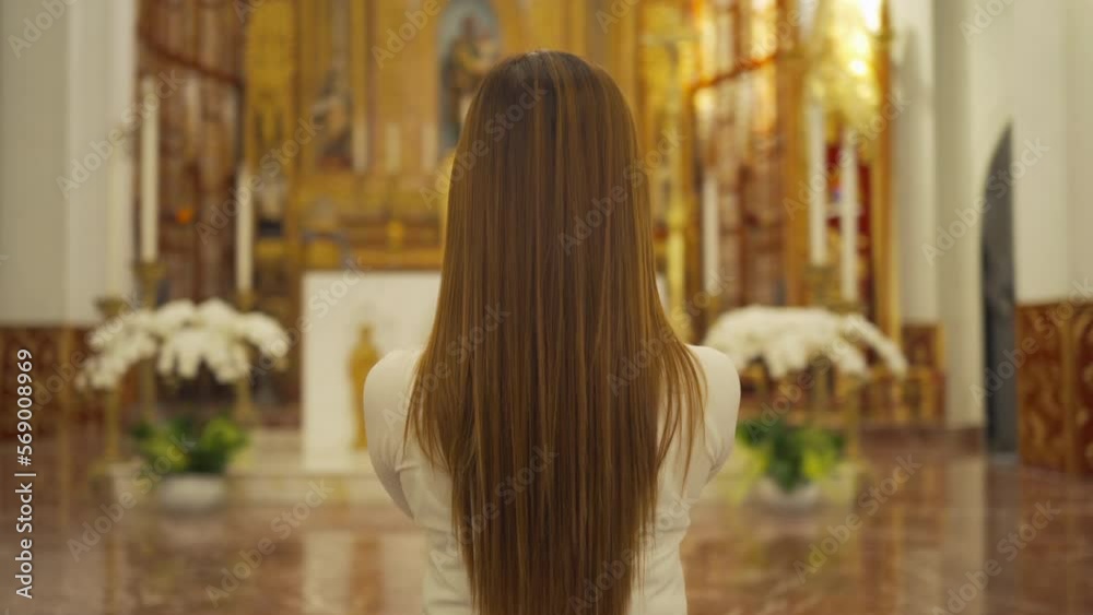 Asian Vietnamese woman praying in empty christian church with cross ...