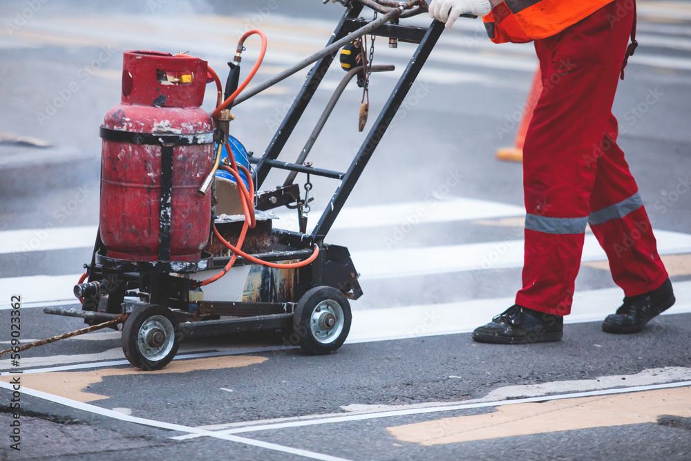 Process of making new road surface markings with a line striping ...