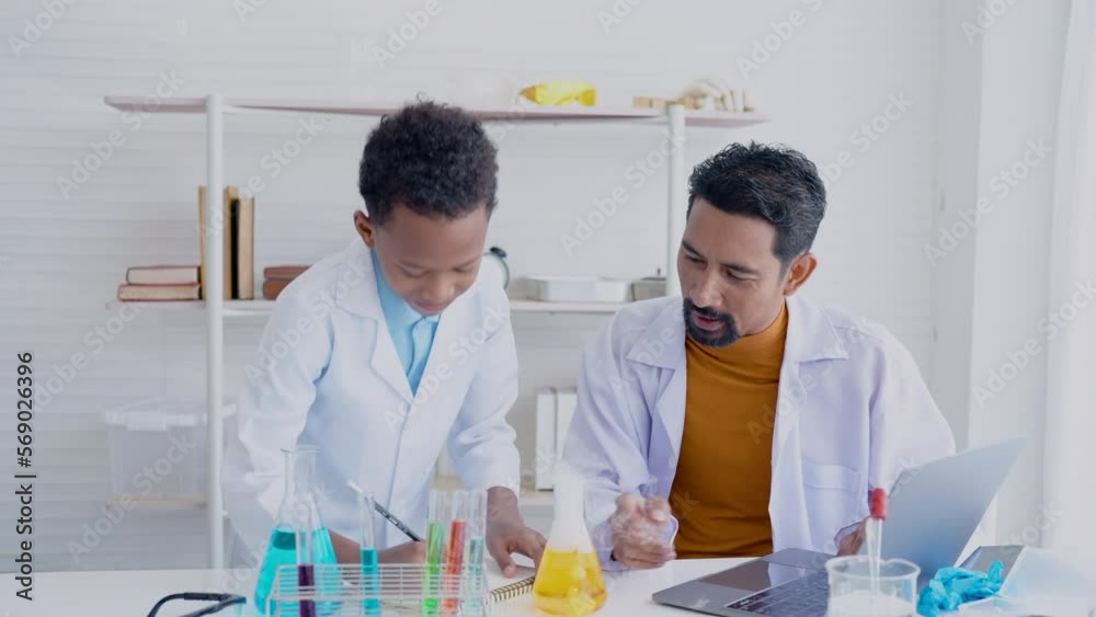 4K, Asian male teacher teaching science Open a scientific example on a ...