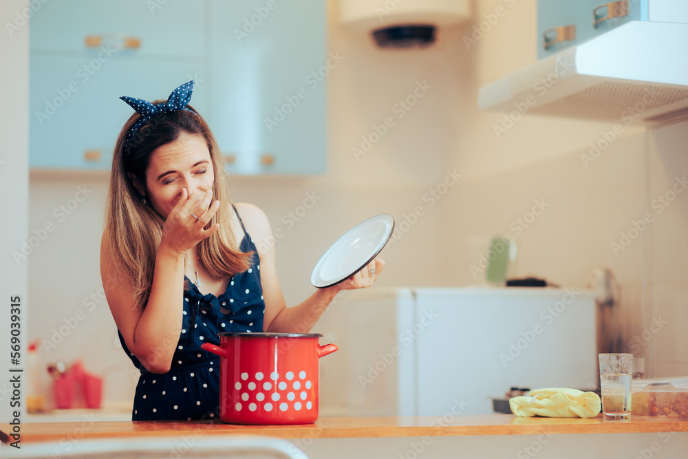 Woman Disgusted by the Bad Smell of the Cooking Pot. Unhappy home cook ...