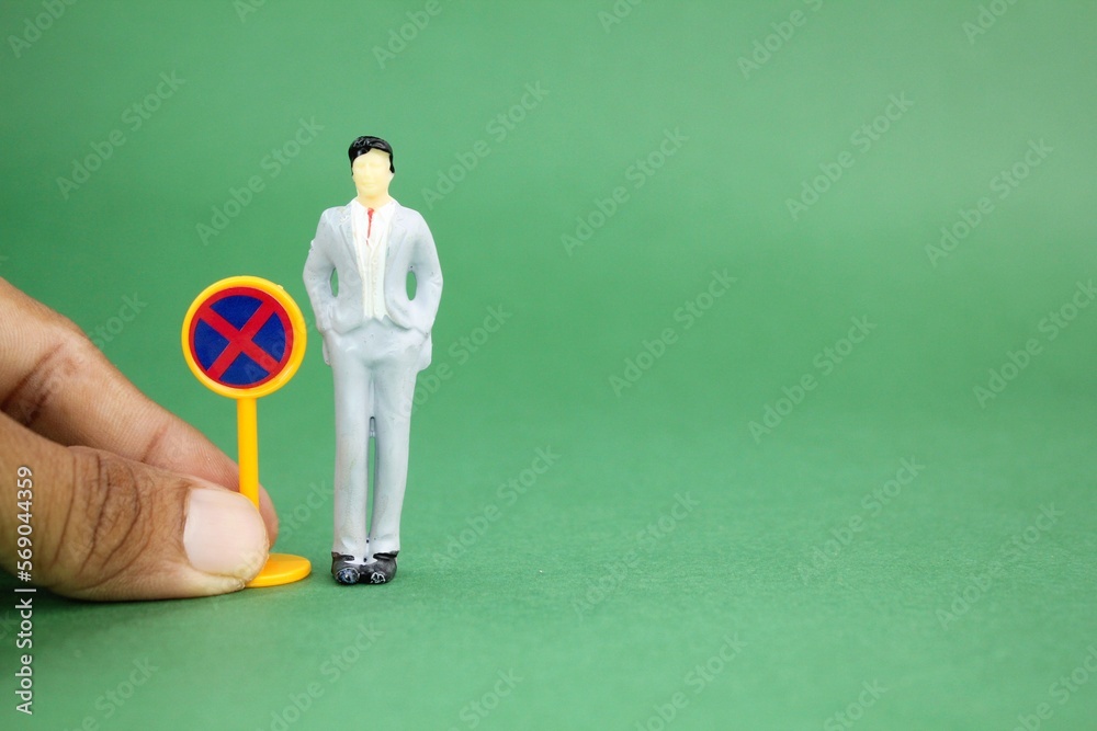 man standing next to a no allowed sign. men are not allowed. No entry ...