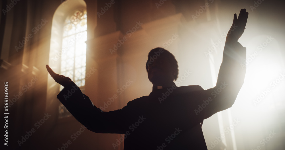 Portrait of Christian Priest Raising Hands In Blessing His Congregation ...