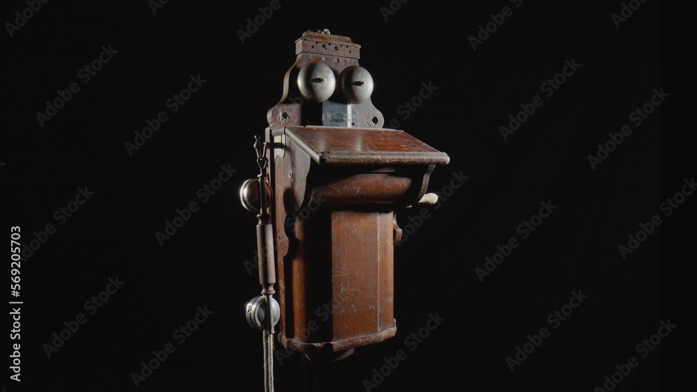 Wooden brown antique telephone apparatus with metal hemispheres for ...