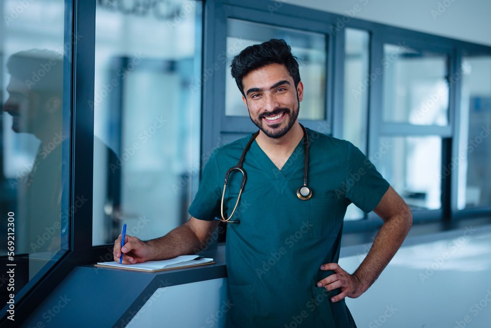 Portrait of young doctor at hospital room. Stock Photo | Adobe Stock