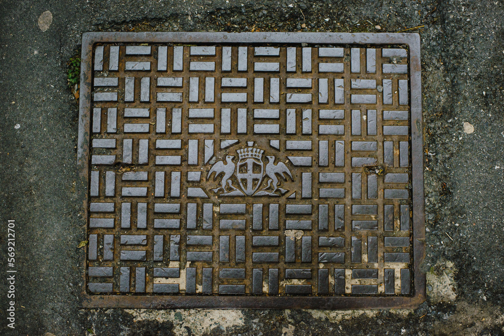 The texture of a square old water trapdoor on a stone pavement Stock ...