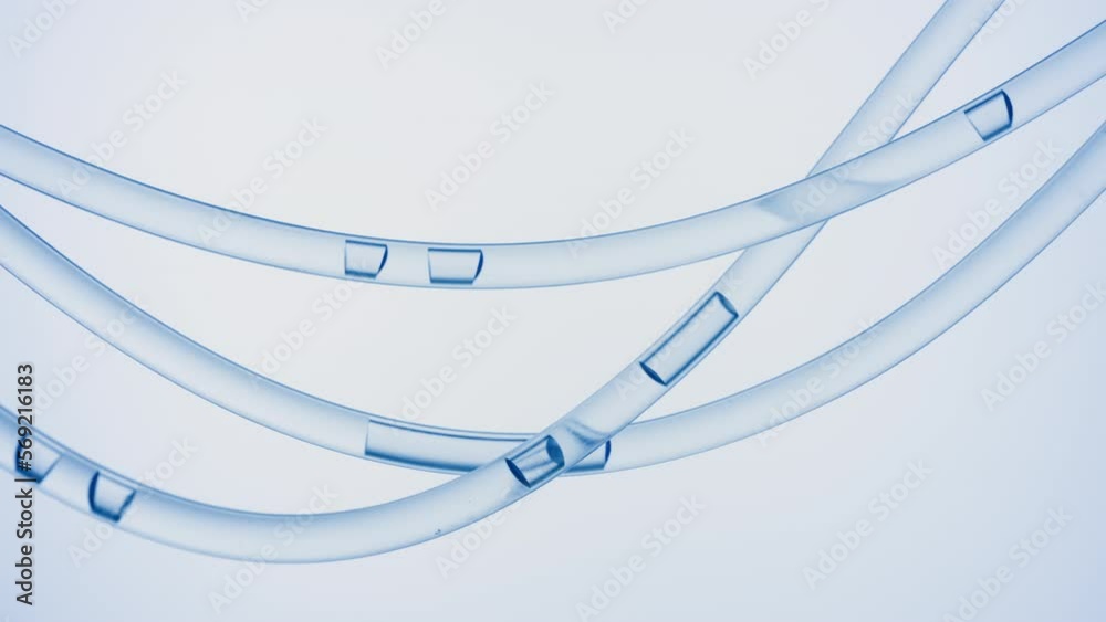 Macro shot of blue transparent fluid is flowing in three transparent ...