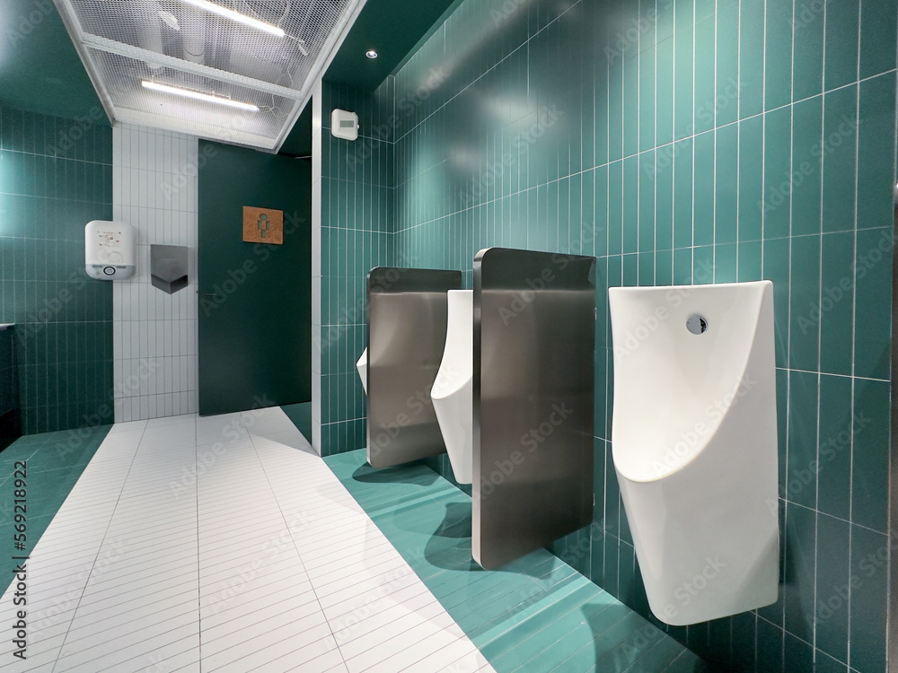 Contemporary interior of public toilet with Green tile walls Stock ...