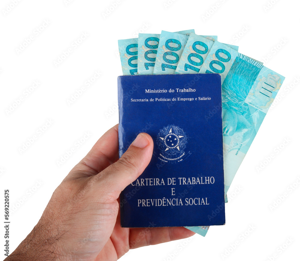 Foto de Hand holding Brazilian work permit and one hundred reais ...