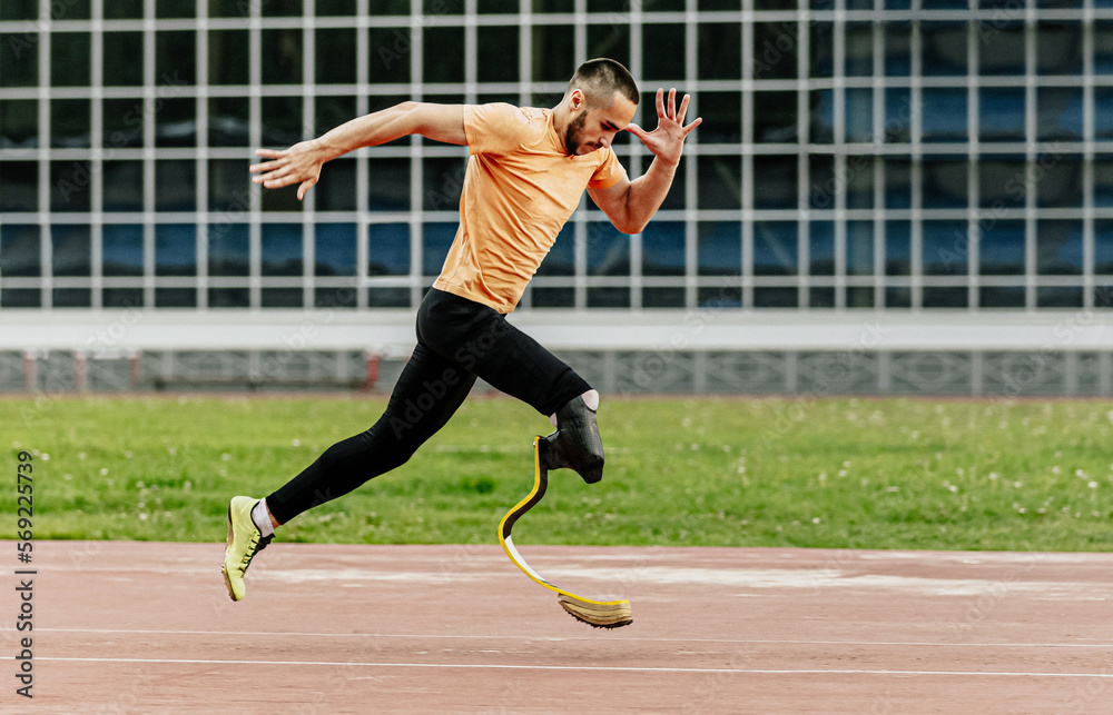 disabled athlete on prosthesis running at stadium Stock Photo | Adobe Stock