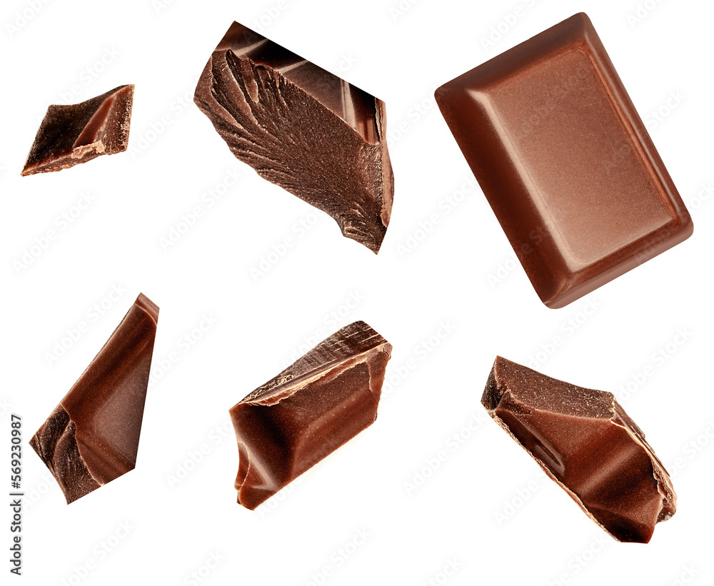 Levitating milk chocolate chunks isolated on white background. Flying ...