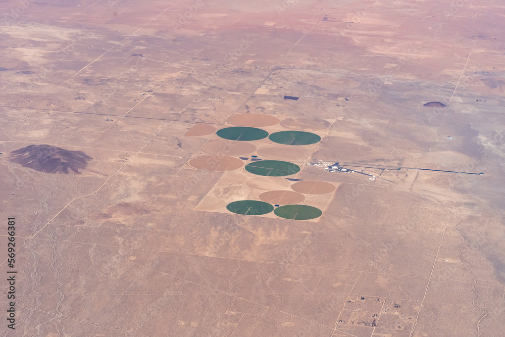 Aerial view of a farm in the Mojave desert - circular fields formed by ...