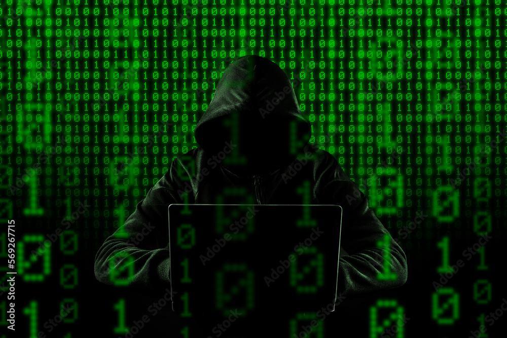 Cybercrime concept. No face hacker with laptop with binary code ...