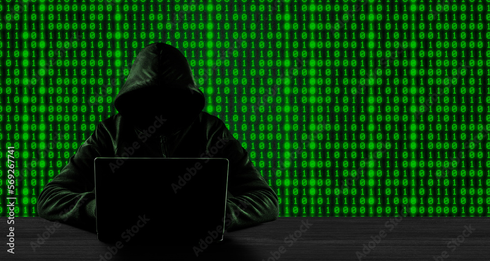 Cybercrime concept. No face hacker with laptop with binary code background. Stock Photo | Adobe ...