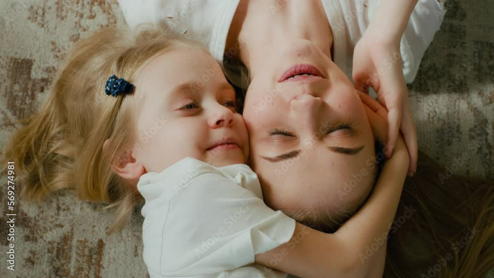 Cute affectionate adopted little kid preschool girl hugging cuddling ...