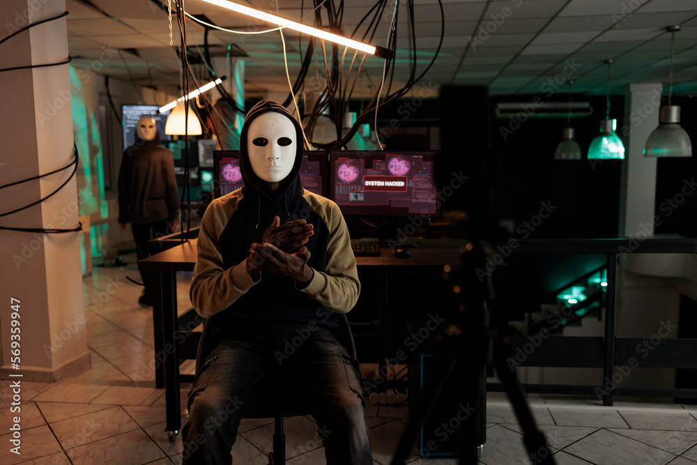 Ransomware and internet blackmail concept at night, anonymous scammer ...