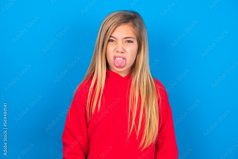 Body language. Disgusted stressed out caucasian teen girl wearing red ...
