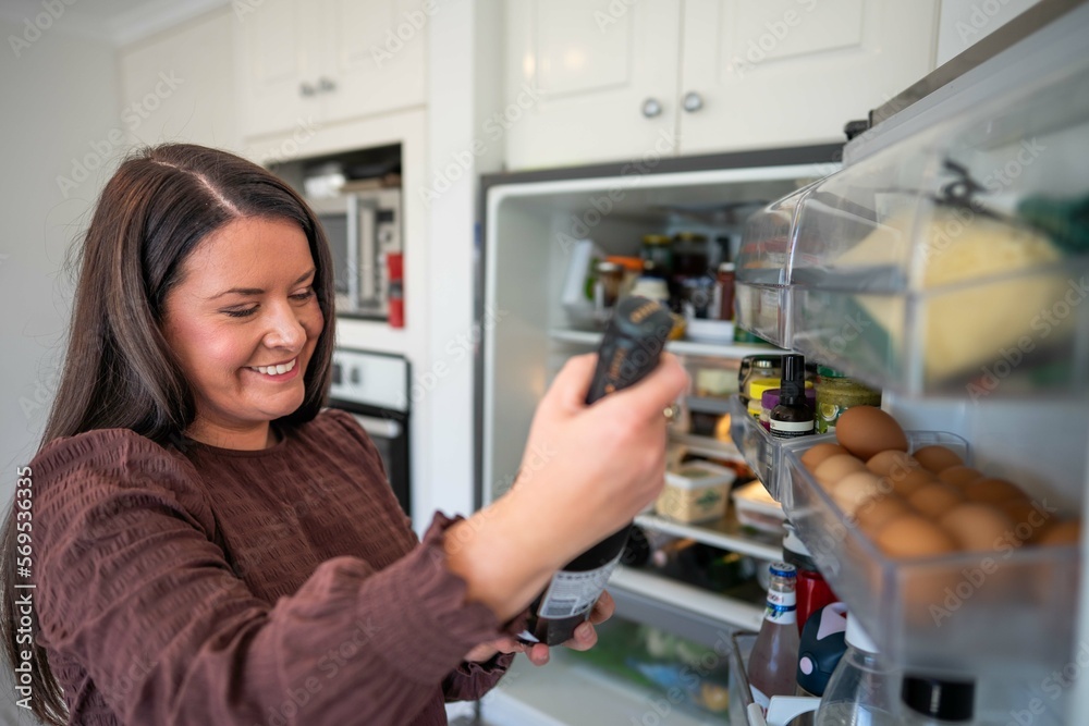 Getting food out of the fridge. Beer in the fridge. Fridge full of food ...