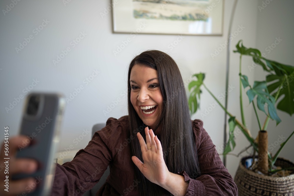 Girl video calling her friends on a zoom call. Woman on holiday skyping ...