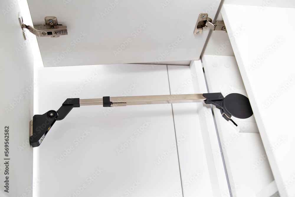 The modern lifting mechanism of a facade of a door with the closer ...