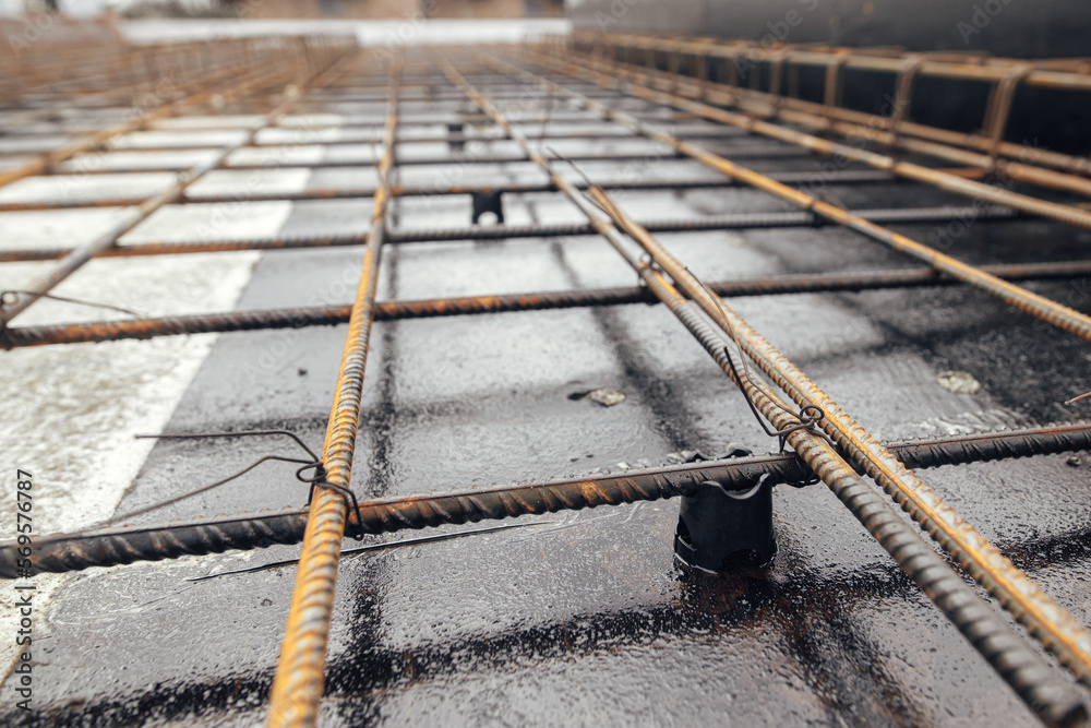 Reinforcement rods at construction site. Steel rebar mesh close up ...