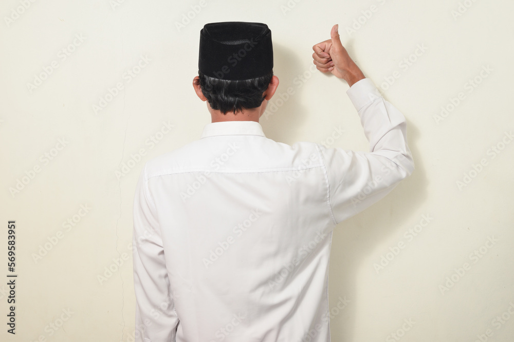 portrait of asian man turning over. asian man standing back view ...