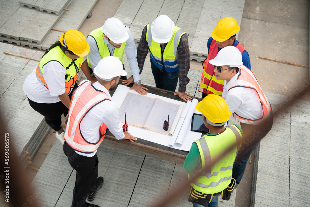 Construction engineers, architects, and foremen form a group ...