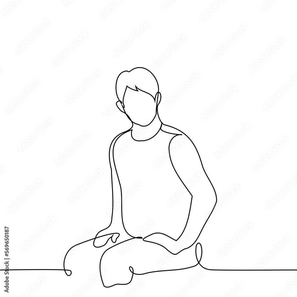 man sits in a confident pose leaning his hands in his hips he turned ...