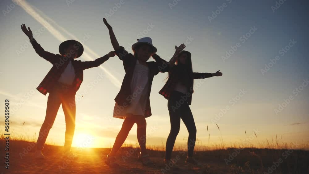 Video Stock group of kids dancing in the park silhouette at lifestyle ...