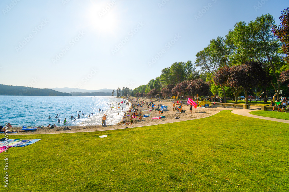Tourists and local Idahoans enjoy a summer afternoon at the City Beach ...