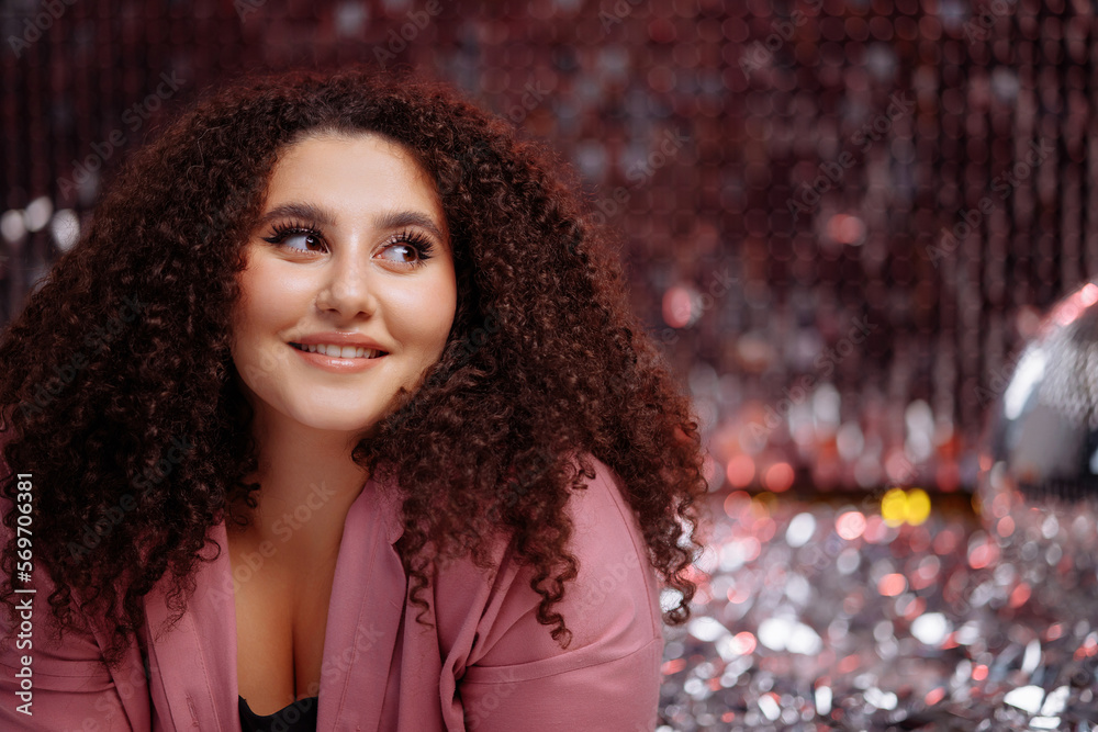 Beautiful, confident woman plus size model in a pink cape and black ...