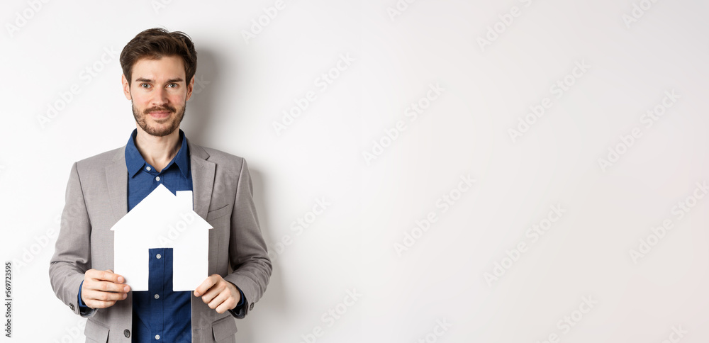 real-estate-and-insurance-concept-salesman-in-grey-suit-showing-paper