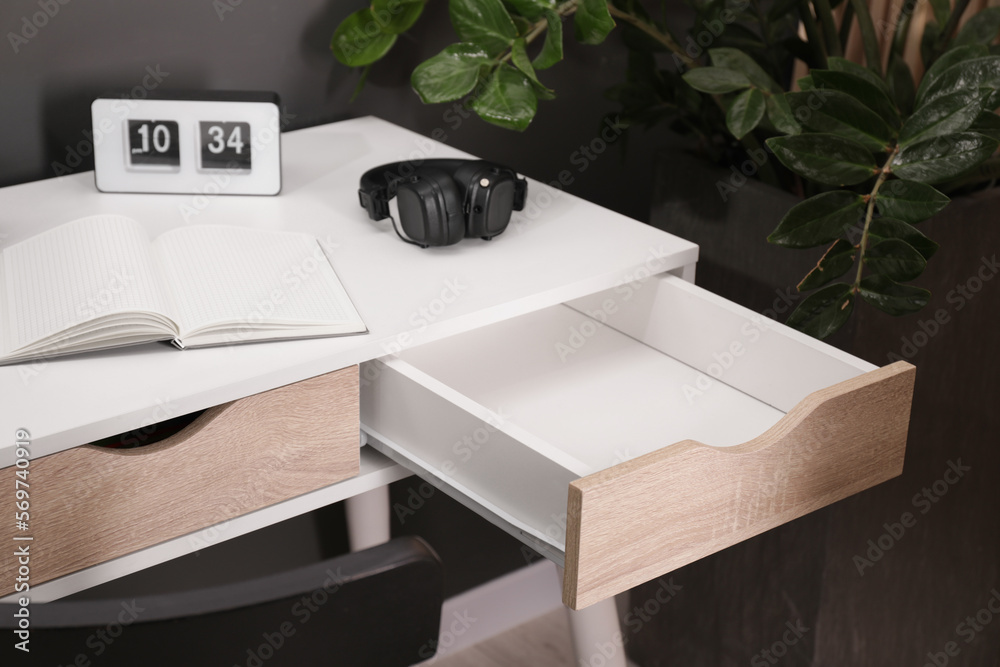 Stylish desk with open empty drawer in office Stock Photo | Adobe Stock
