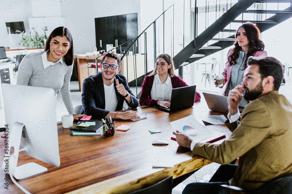 group of young hispanic business people or teamwork working in a video ...