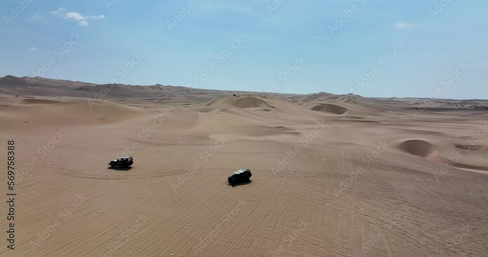 Dune buggies in Huacachina, Peru desert. Fast sand buggy driving on the ...