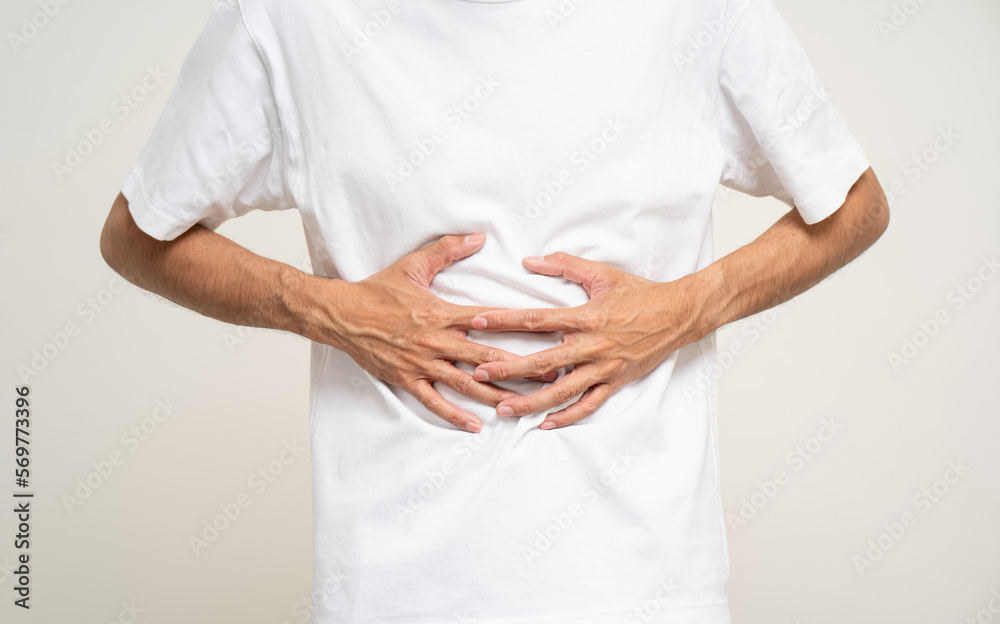 Man had a stomach ache and gastritis. He put hand on his stomach and ...