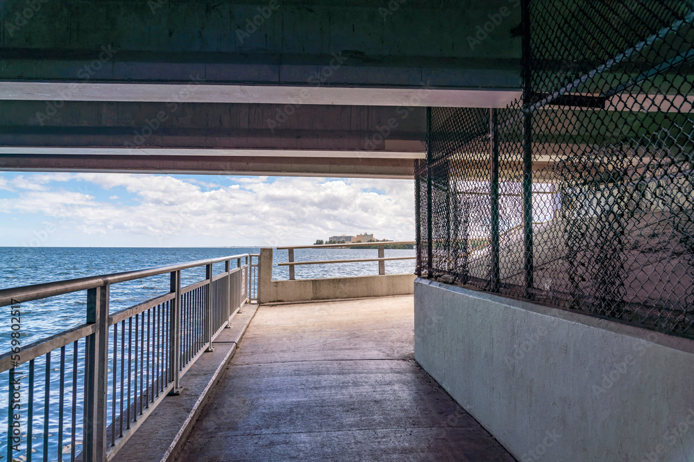 Concrete walkway at Rickenbacker Causeway underneath the bridge in ...