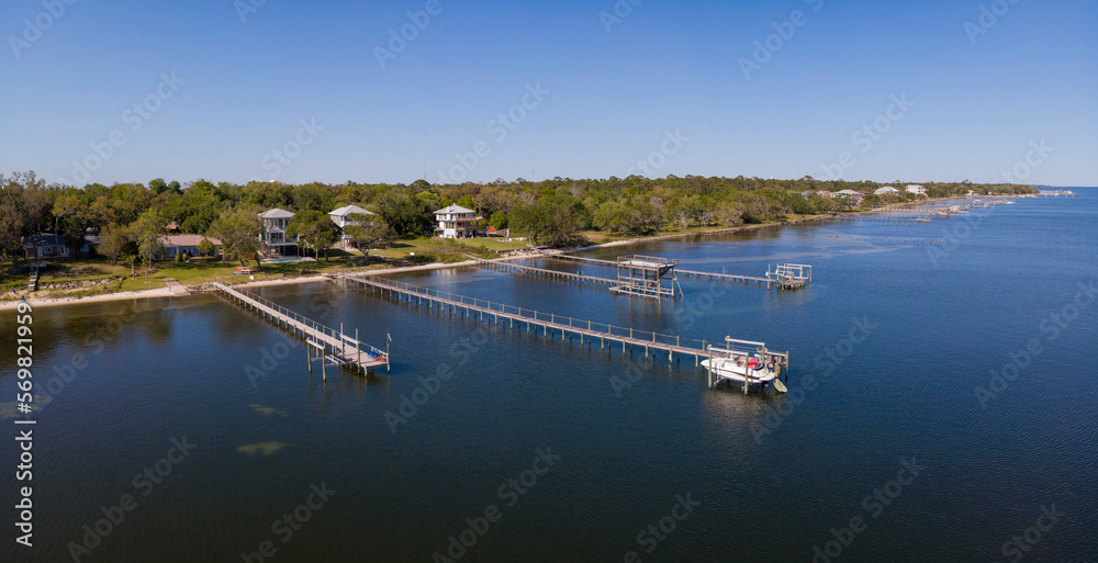 Private docks with roofs and boat lifts in high angle view- Navarre ...
